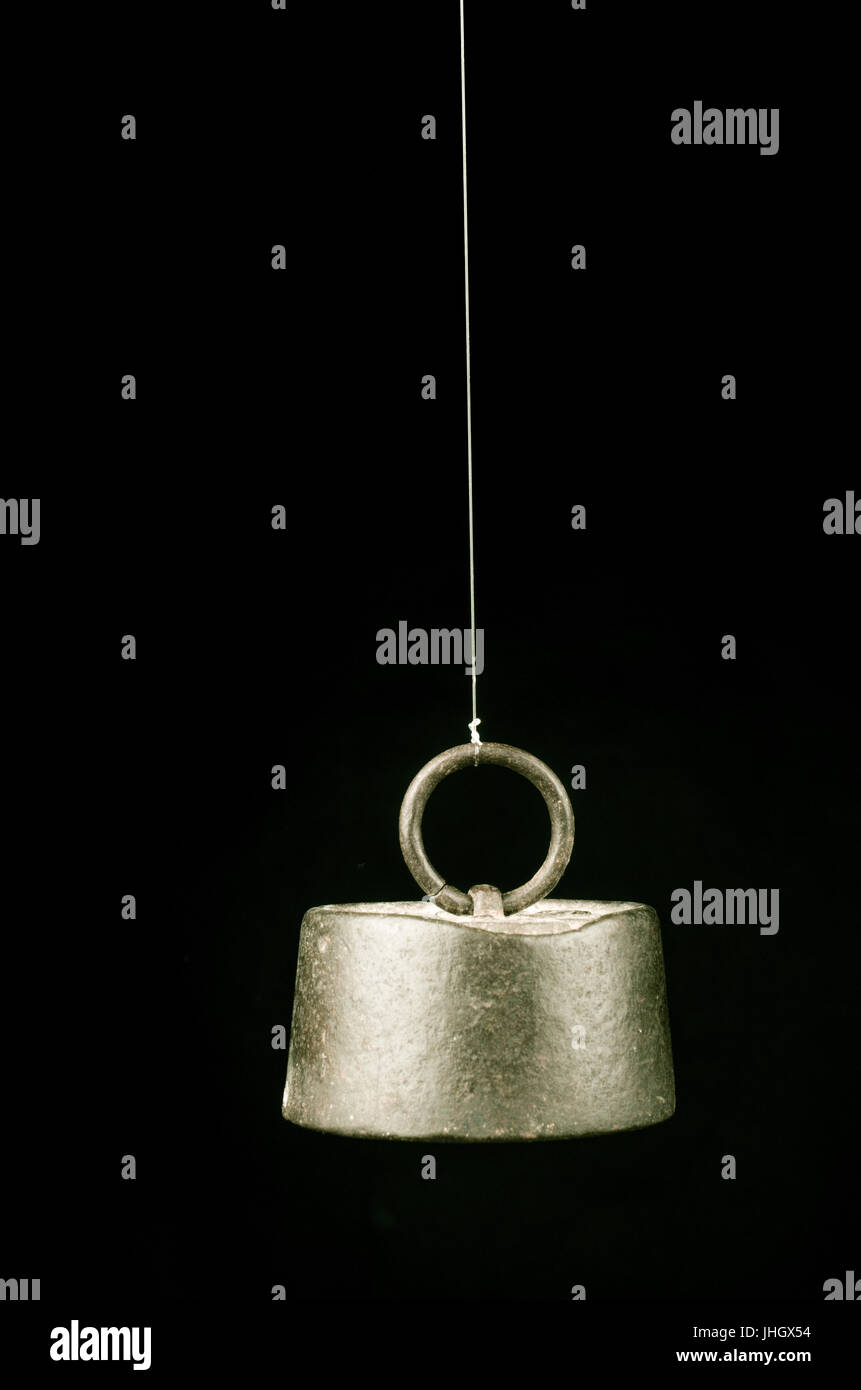 Hanging by a thread, a conceptual shot about extremely risky behaviour ...