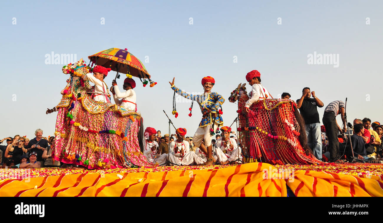 PUSHKAR, INDIA - MAR 7, 2012. Rajasthani folk dancers in colorful ...