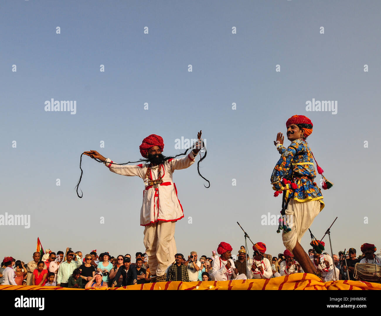 PUSHKAR, INDIA - MAR 7, 2012. Rajasthani folk dancers in colorful ...