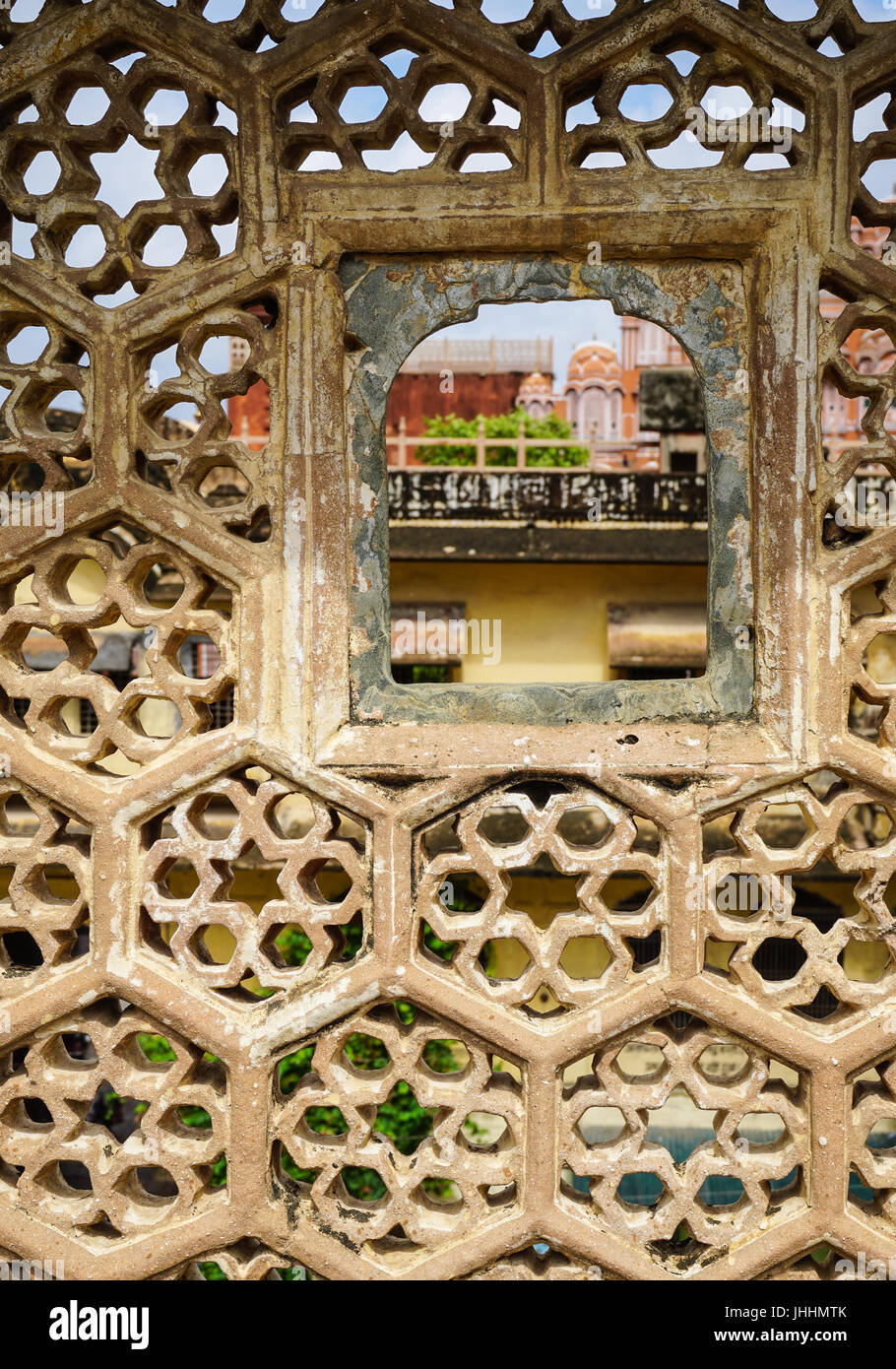 Stone louver with window at the ancient castle in Jaipur, India. Jaipur ...