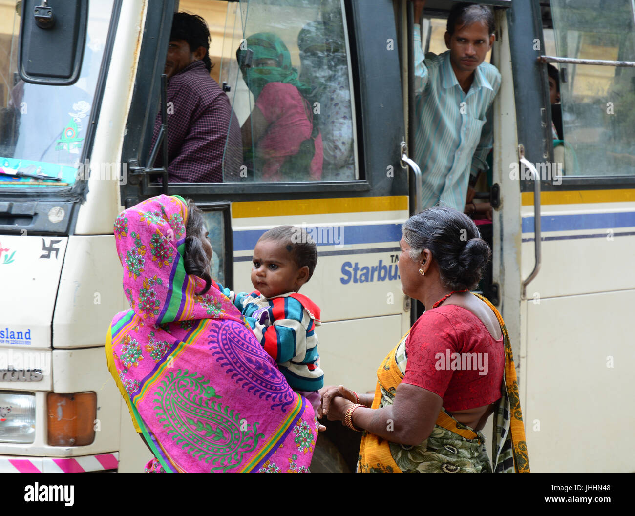 Jaipur, India - Jul 27, 2015. People waiting at the bus stop in Jaipur ...