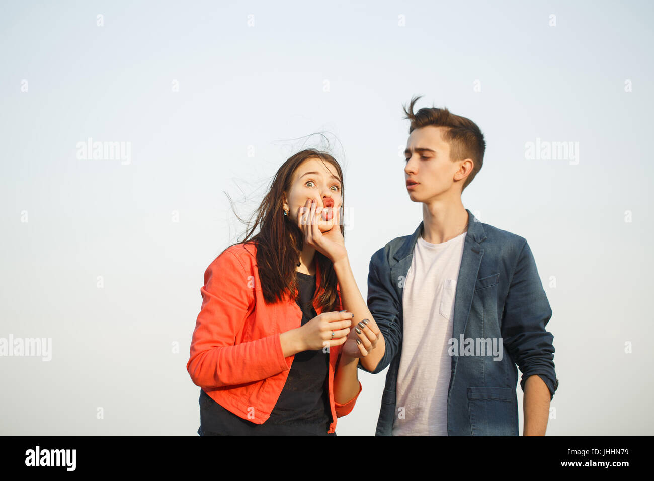 First love. Romantic hugs. Teenagers on a date. They are fooling around ...