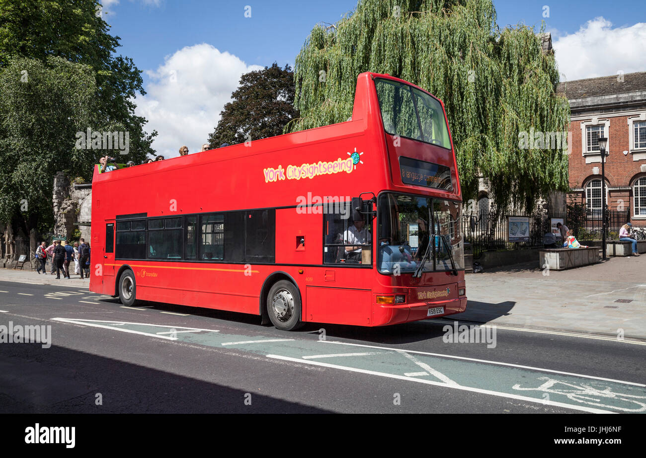 A red sightseeing bus in the centre of York,England,UK Stock Photo - Alamy