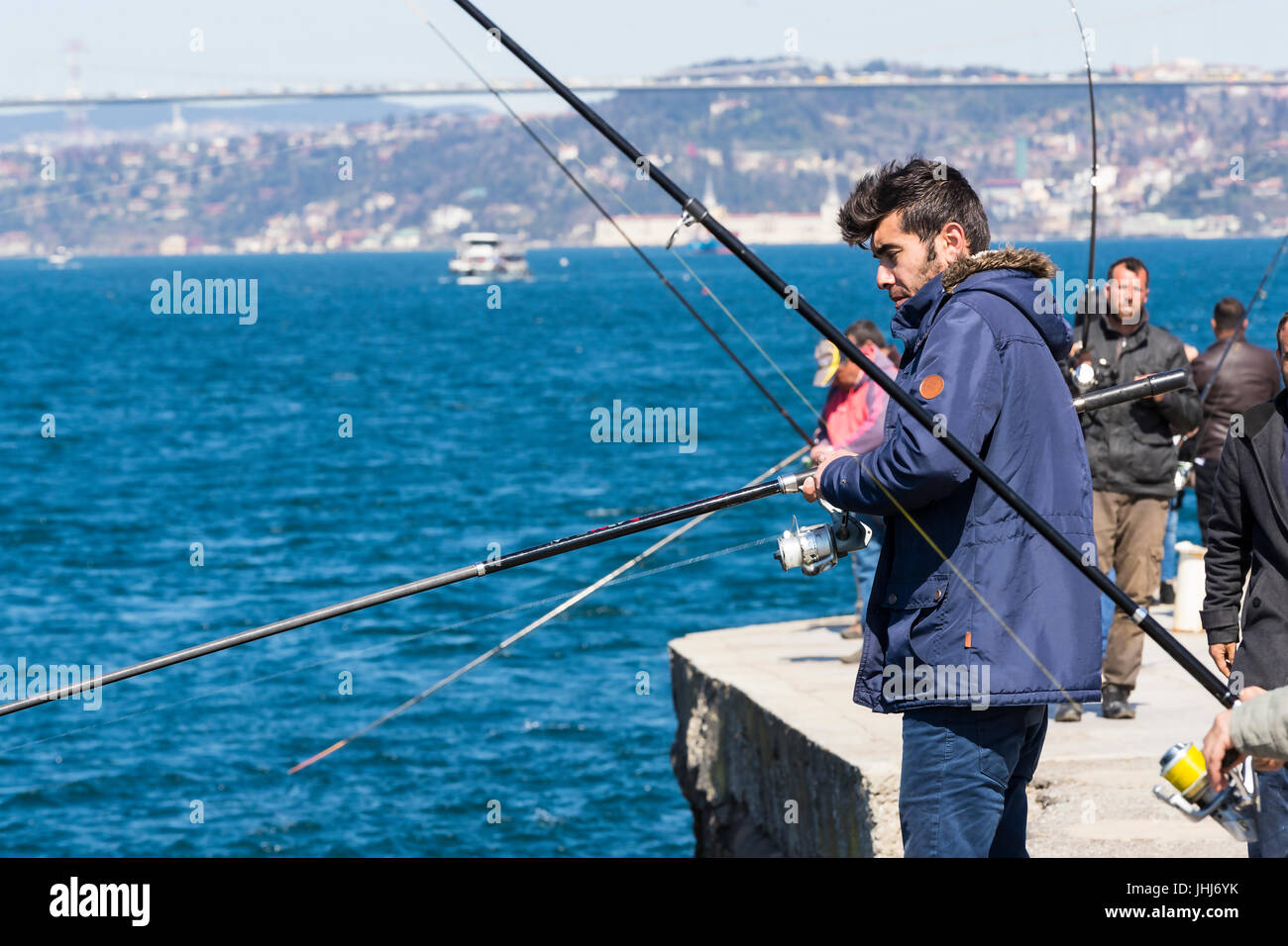 ISTANBUL, TURKEY - 1 APRIL , 2017: Fishermen are fishing on the banks ...