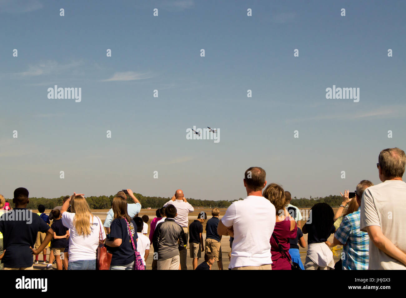 Blue angels flying over a cheering crowd at their home base in ...