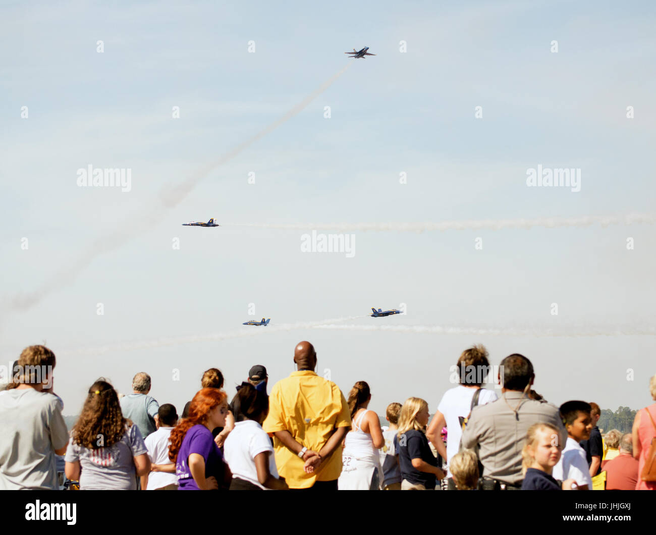 Blue angels flying over a cheering crowd at their home base in ...
