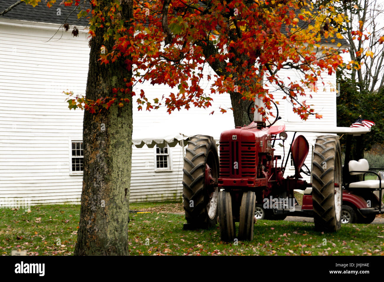 Tractor with New England Autumn leaves Stock Photo - Alamy