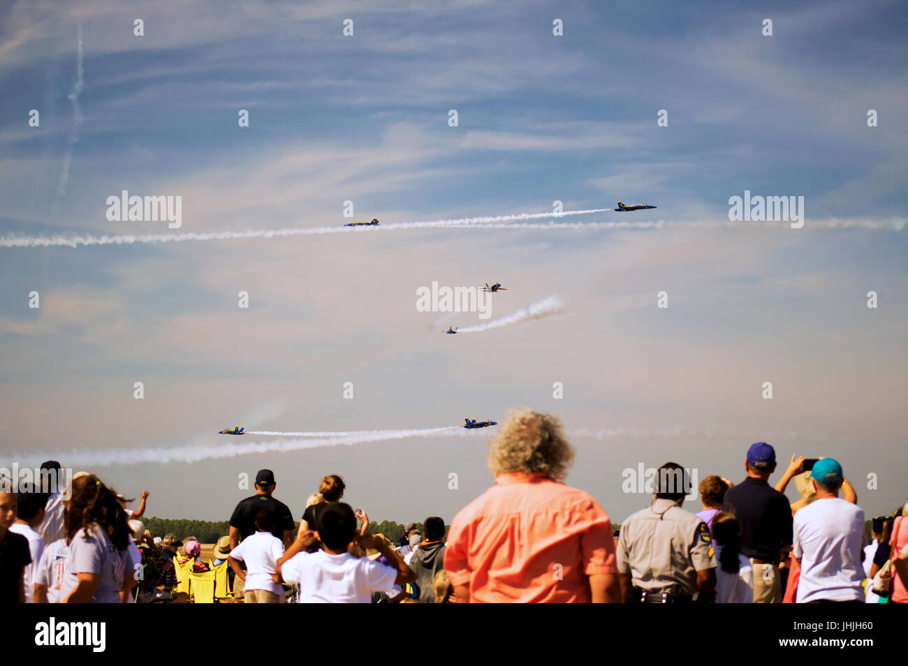 Blue angels flying over a cheering crowd at their home base in ...