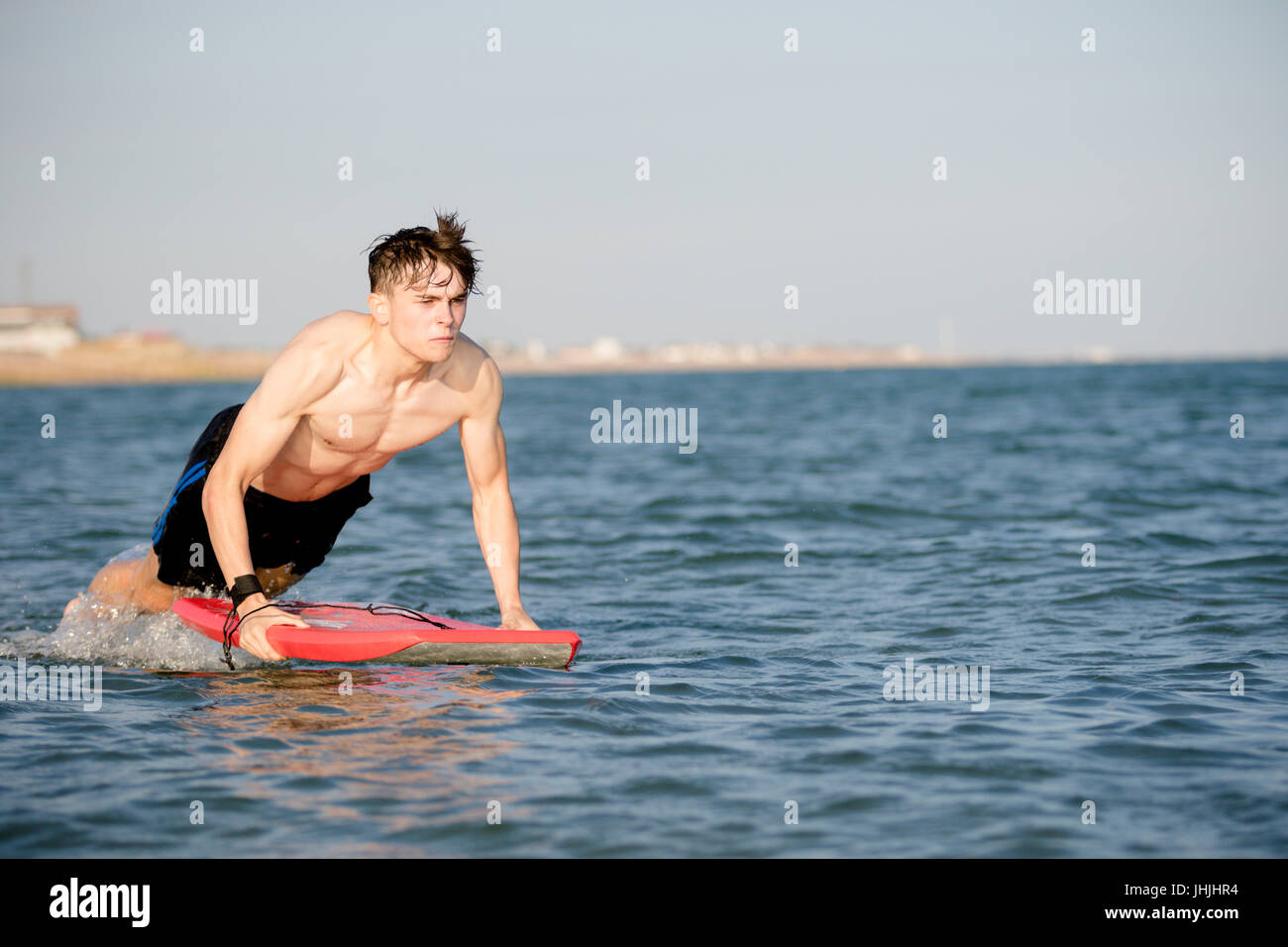 Young boy in sea bodyboard hi-res stock photography and images - Alamy