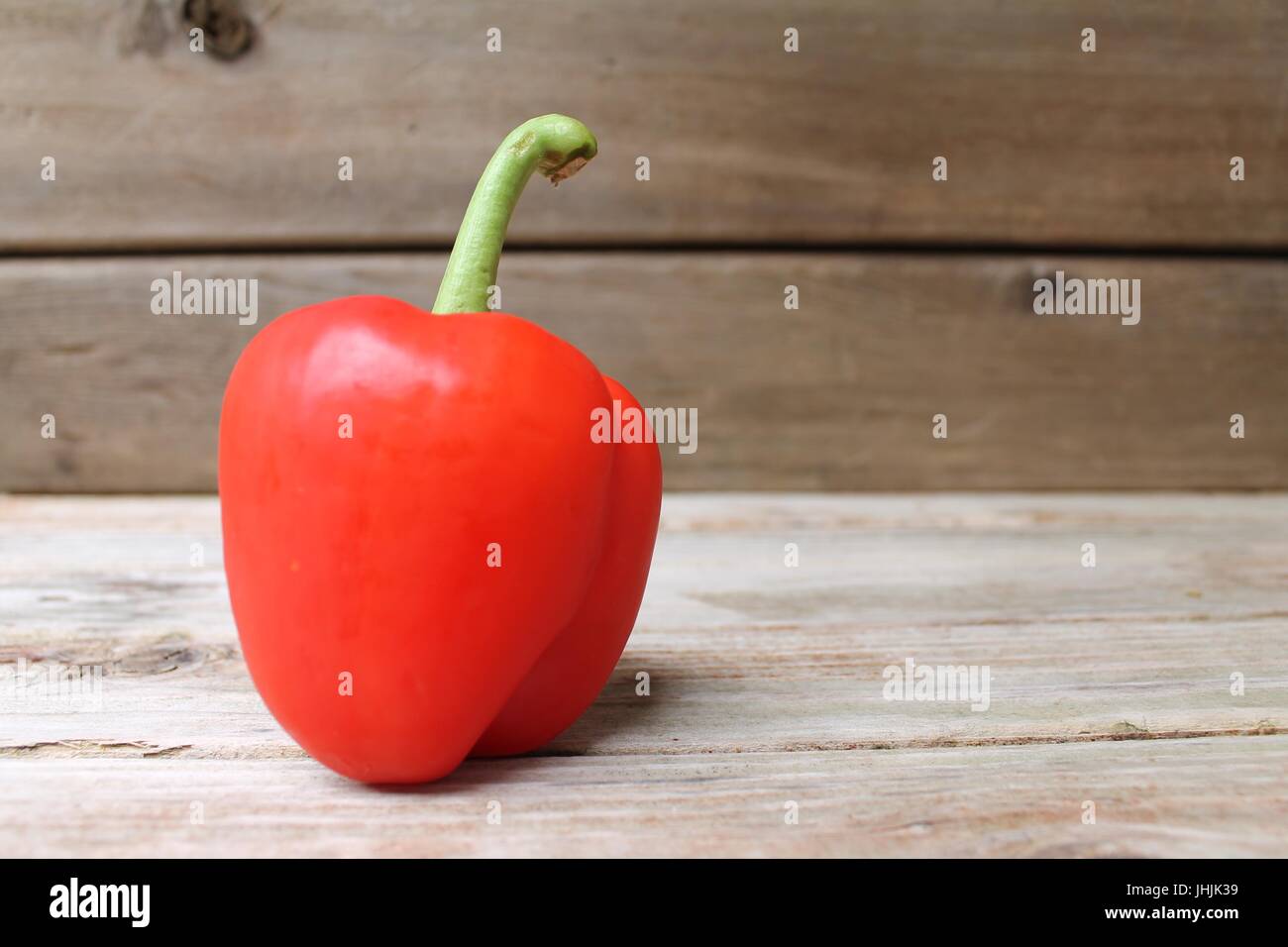 peppers on wood table Stock Photo - Alamy