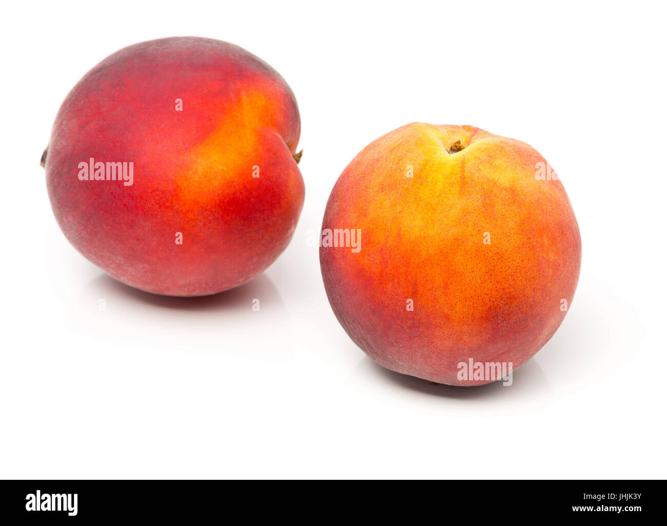 Two uncut, whole, ripe peaches fruit over white background Stock Photo ...