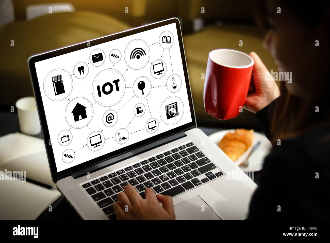 IOT business man hand working and internet of things (IoT) word diagram ...