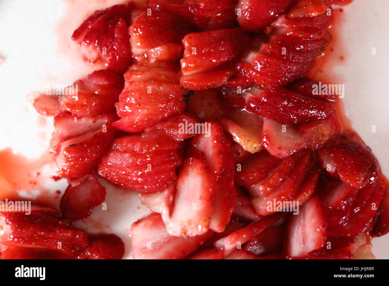 Sliced strawberry. Making frozen strawberry cheesecake series Stock ...