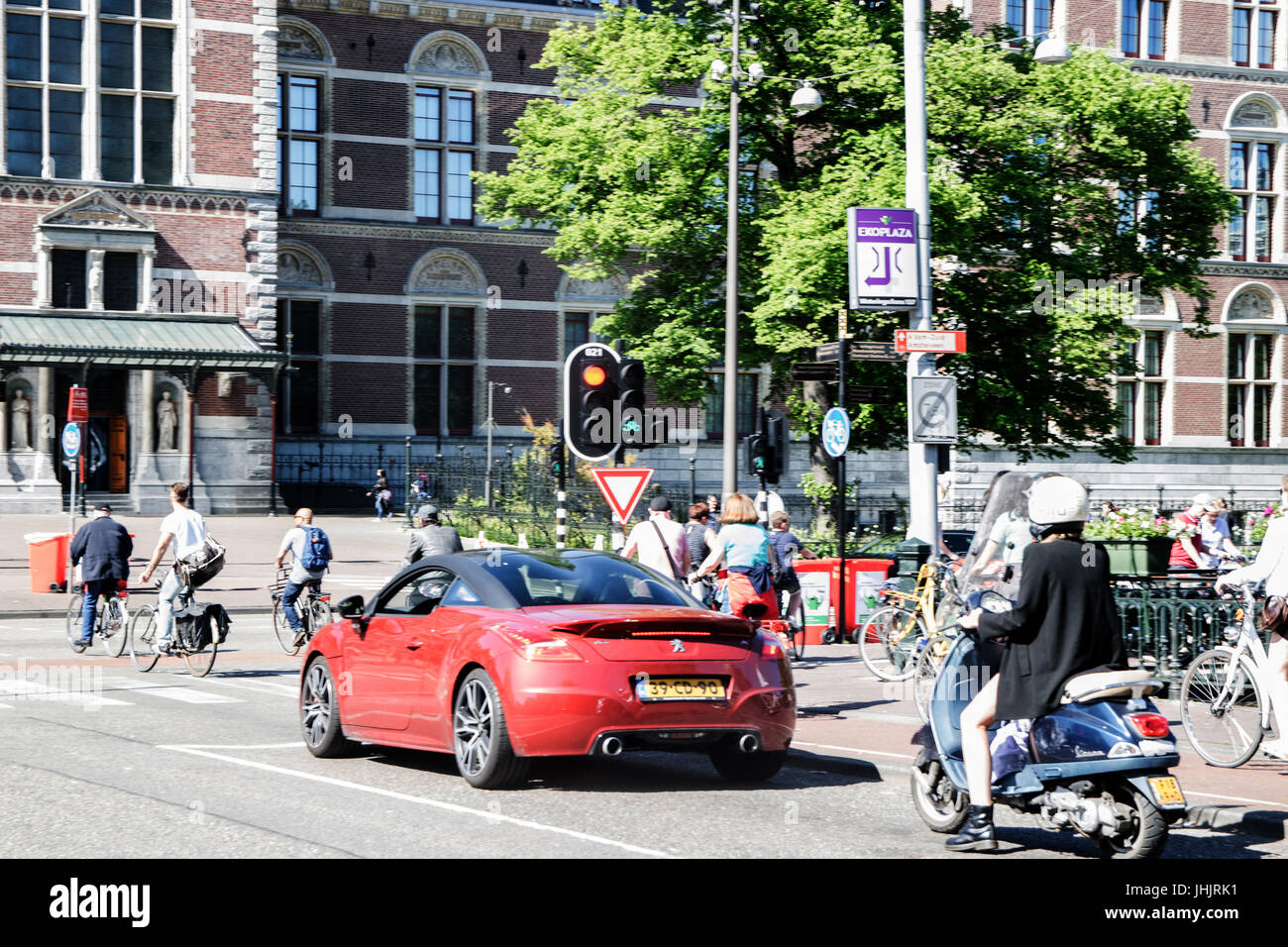 AMSTERDAM, NETHERLANDS - JUNE 03, 2017: traffic stopped at a red light ...