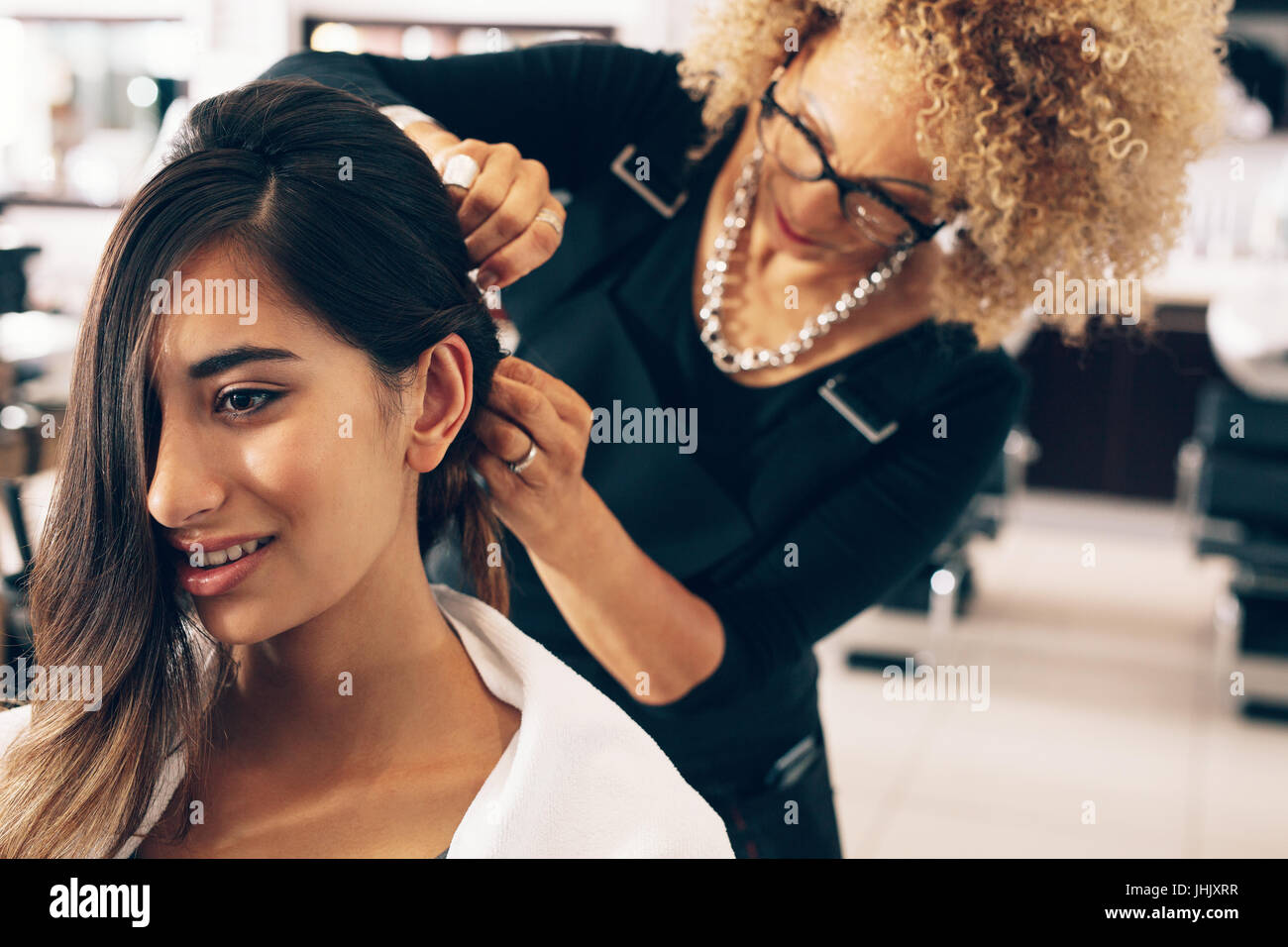 Getting their hair done hi-res stock photography and images - Alamy