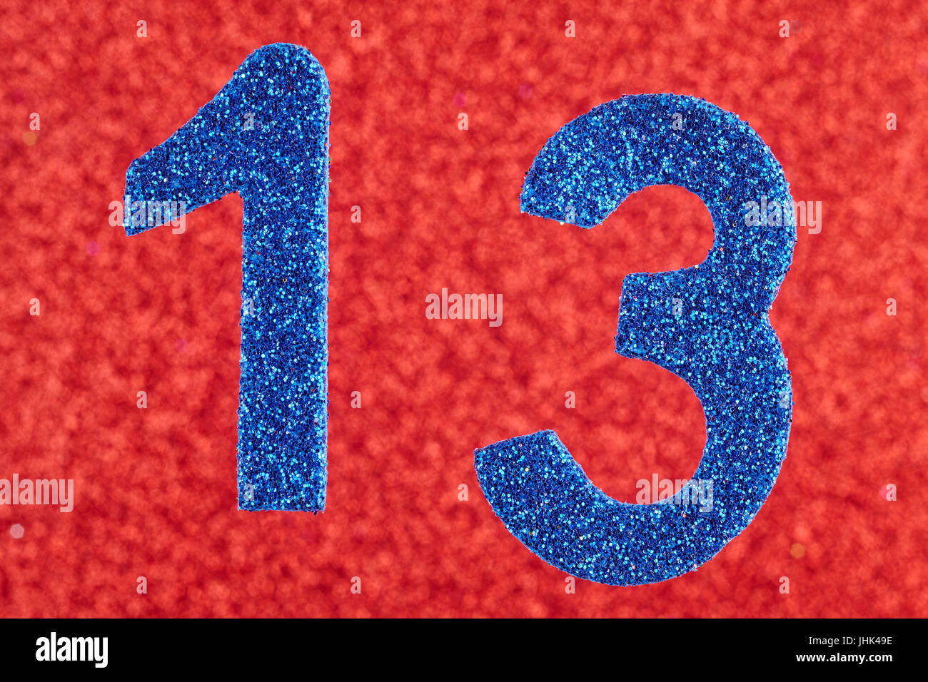 Number thirteen blue color over a red background. Anniversary ...