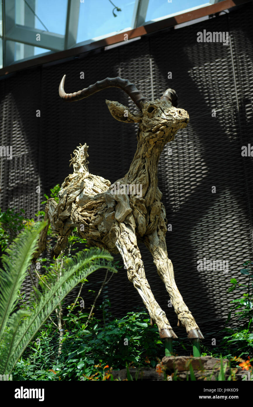 Wooden sculpture/carving of Springbok in flight, in Gardens by the Bay ...