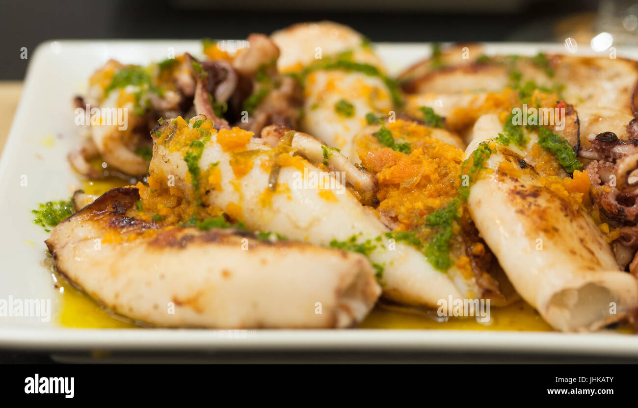 Grilled squid served in a bar Stock Photo - Alamy