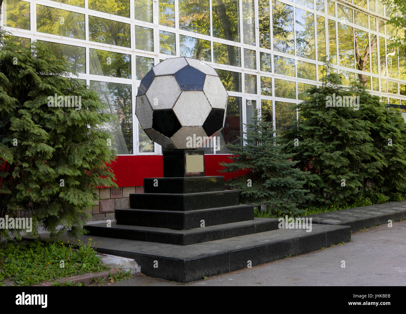Stone Football outside Glass Building Stock Photo - Alamy
