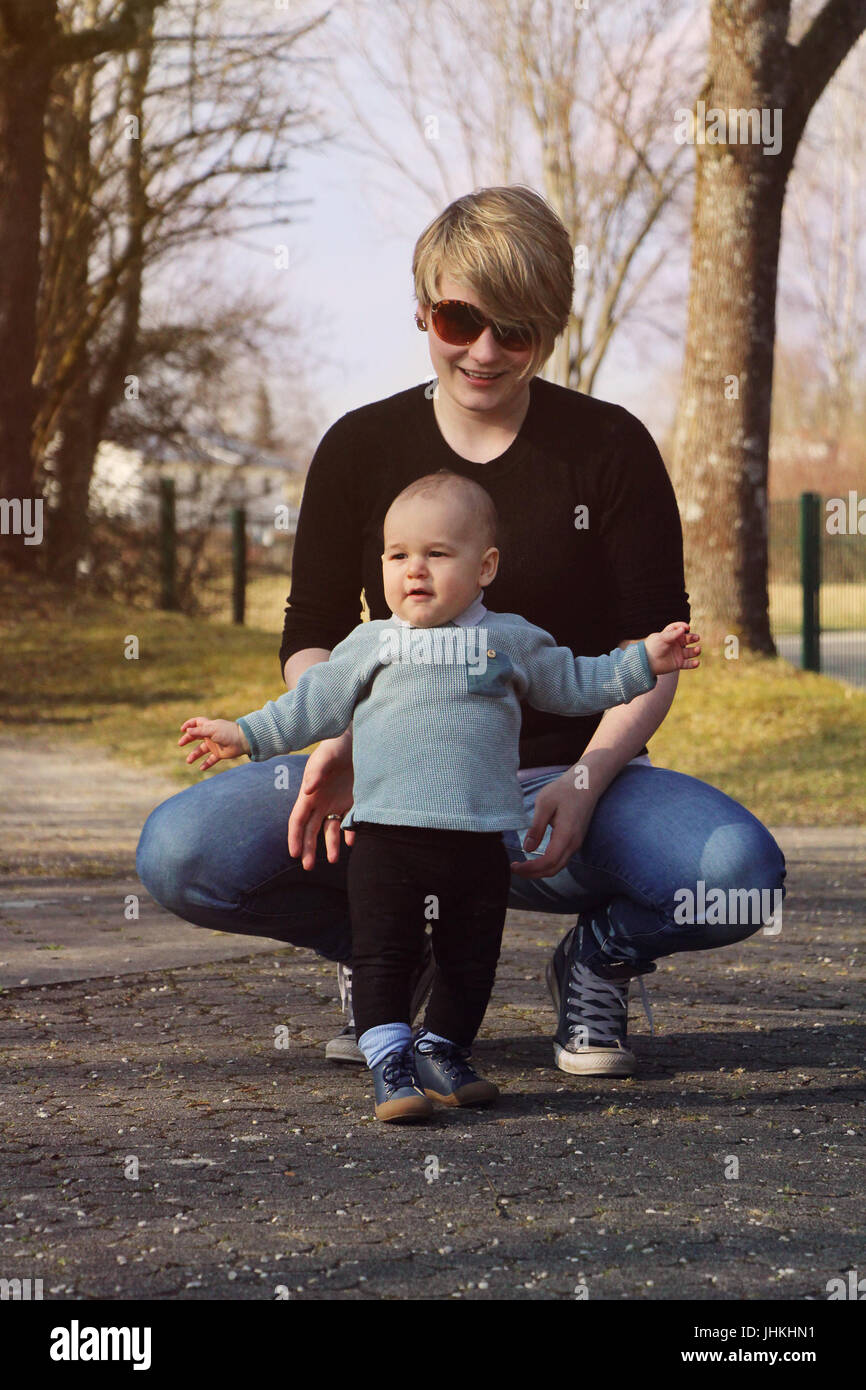 Little boy learning to walk Stock Photo - Alamy