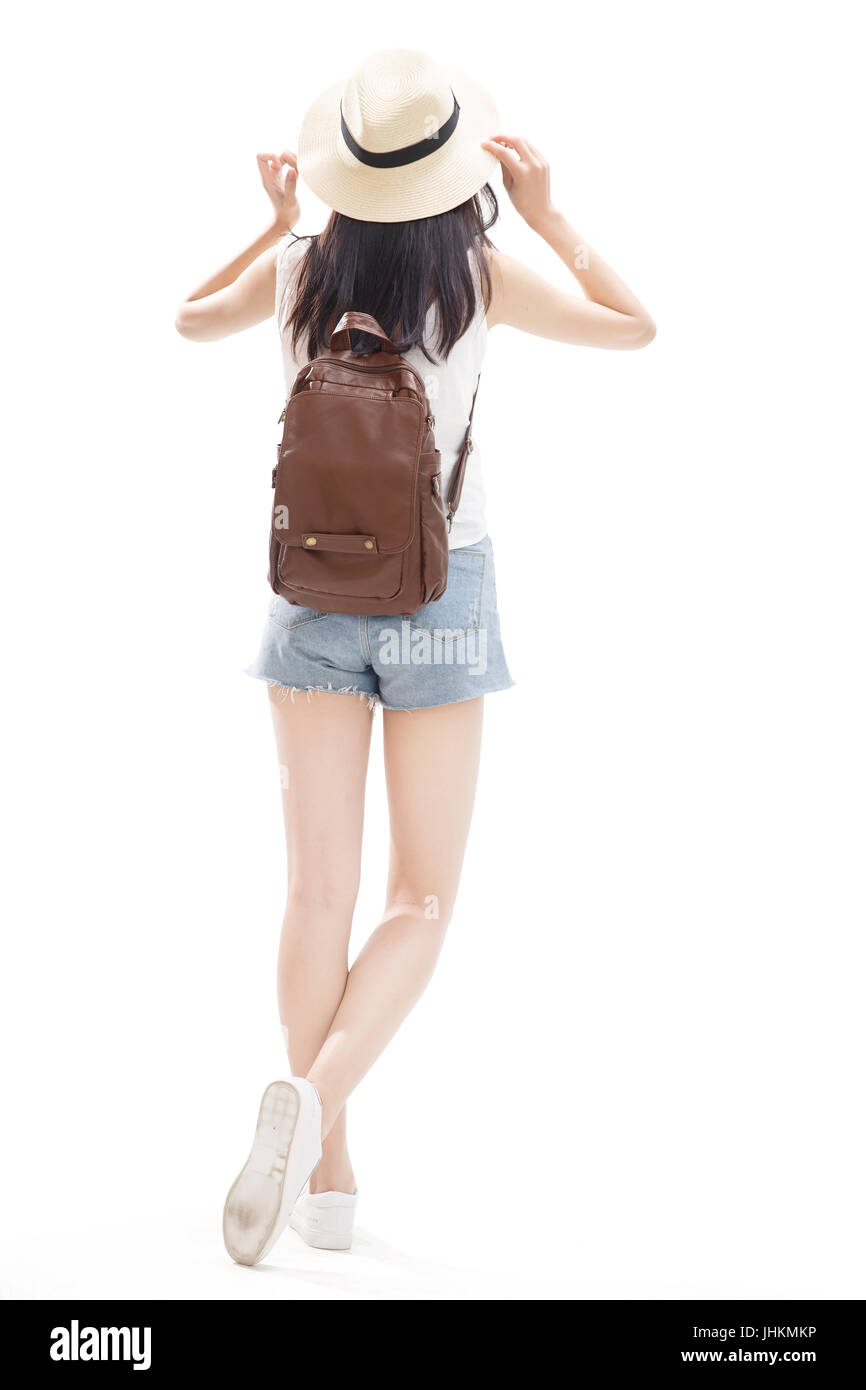 Back view of young woman with backpack Stock Photo - Alamy