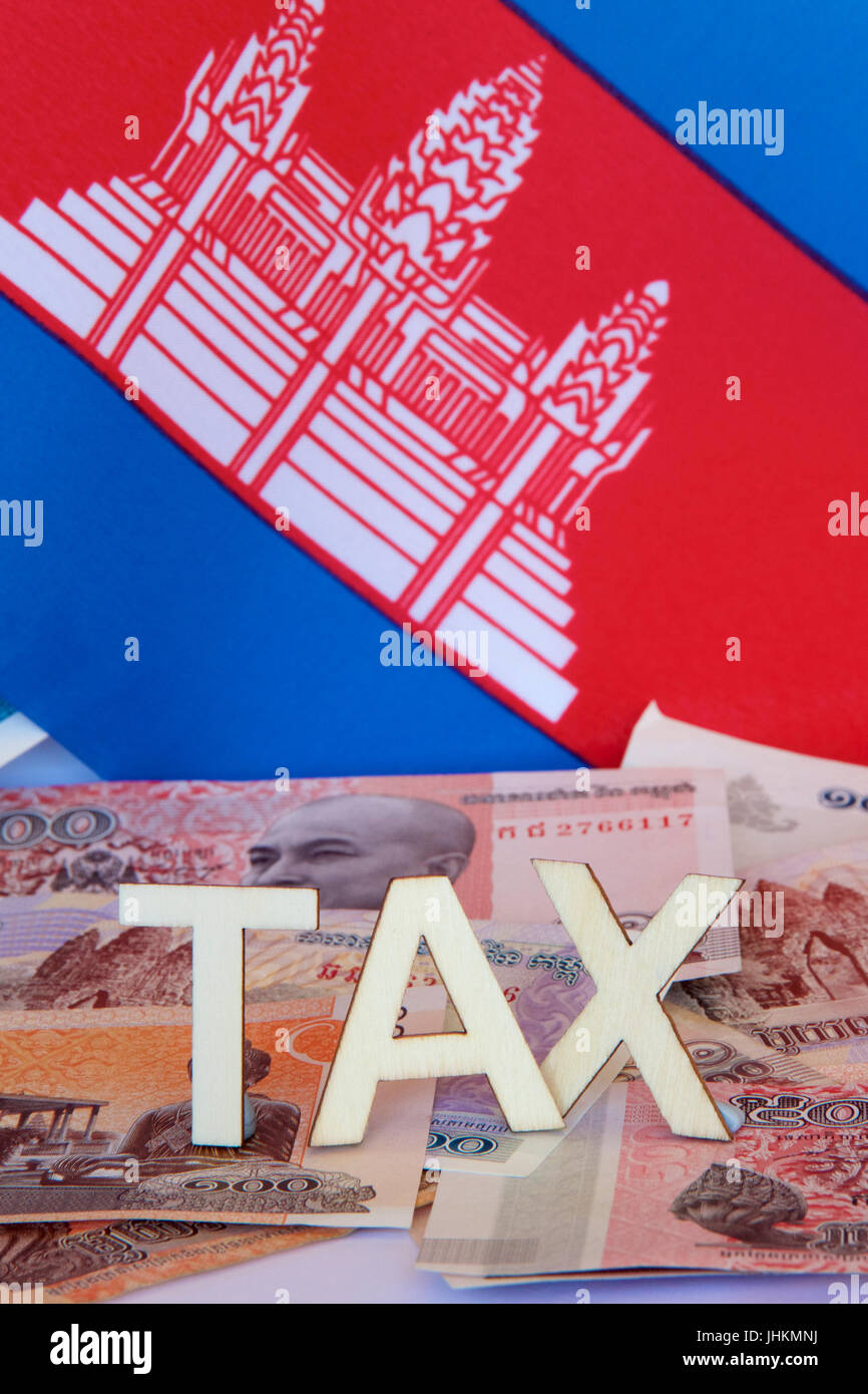 Tax signage with cash and flag Stock Photo - Alamy
