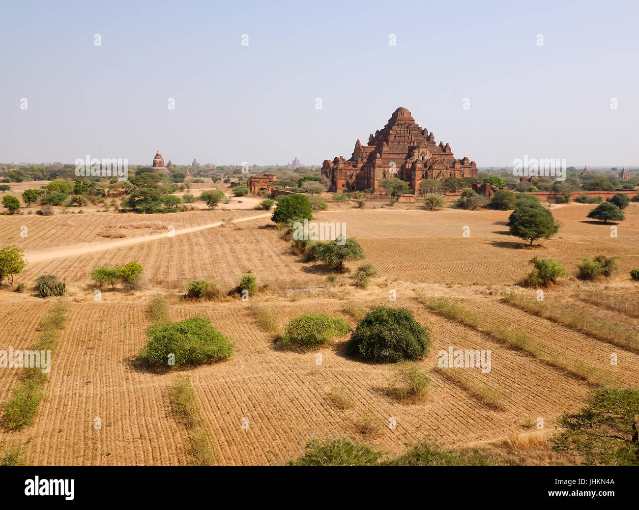 Dhammayangyi Temple with empty field at sunny day in Bagan, Myanmar ...