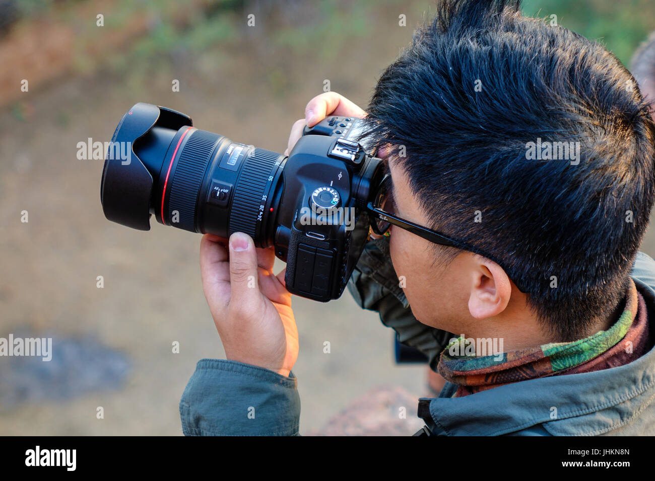 An Asian tourist with a DSLR camera in Bagan, Myanmar Stock Photo - Alamy