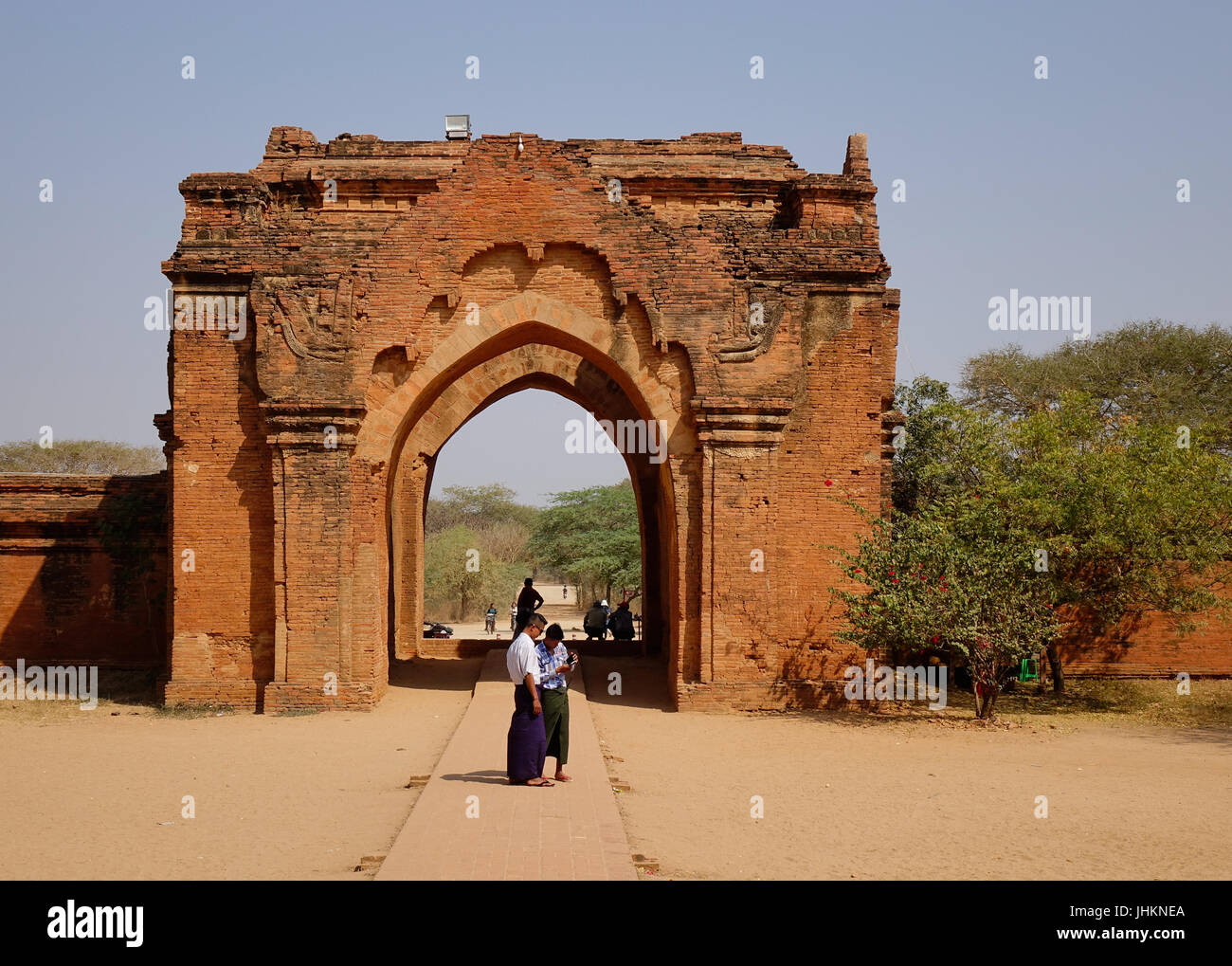 Bagan, Myanmar - Feb 18, 2016. People at the gate of Guni temple in ...