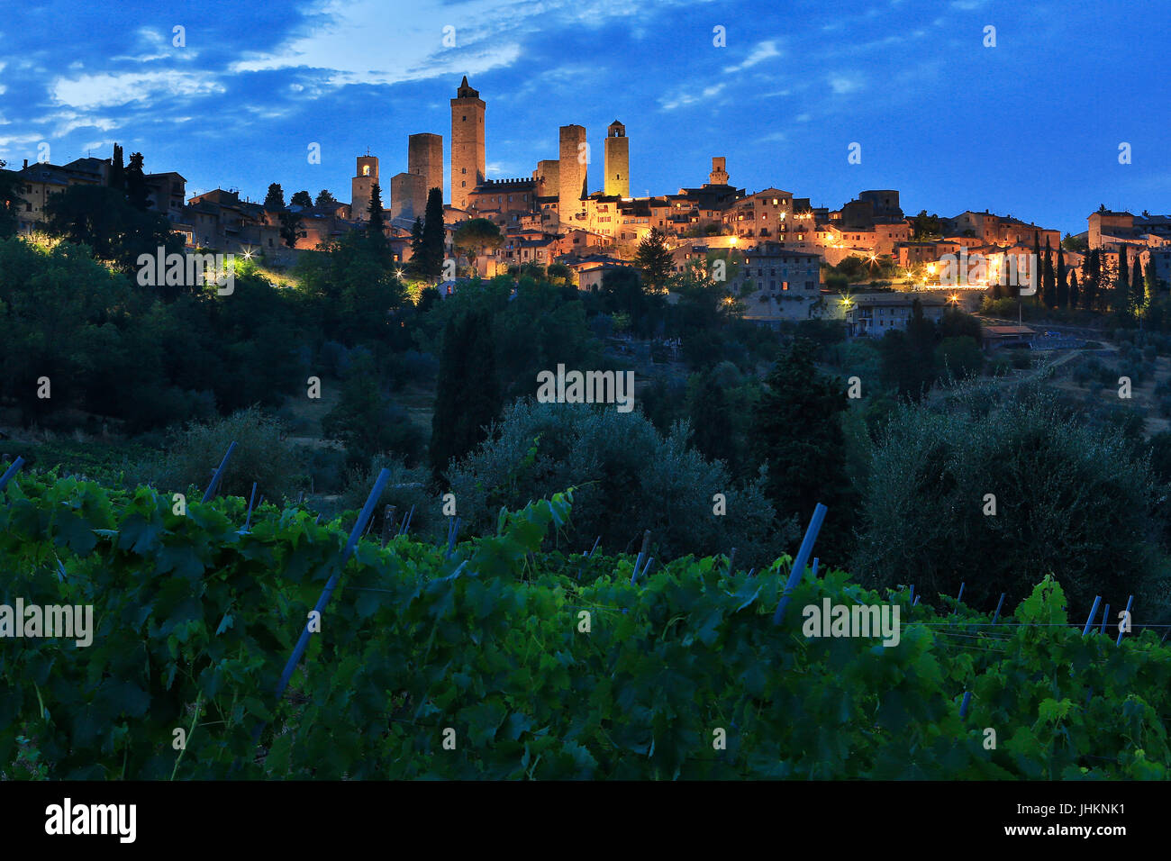 The skyline of the medieval walled town of San Gimignano (Tuscany ...