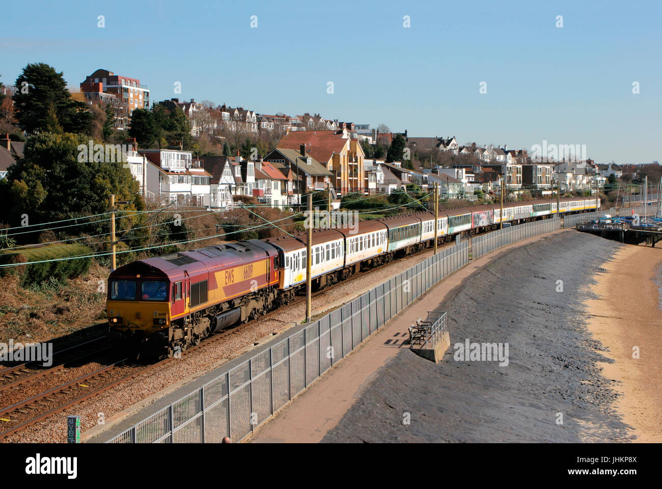 An EWS class 66 diesel locomotive with a train of redundant slam door ...