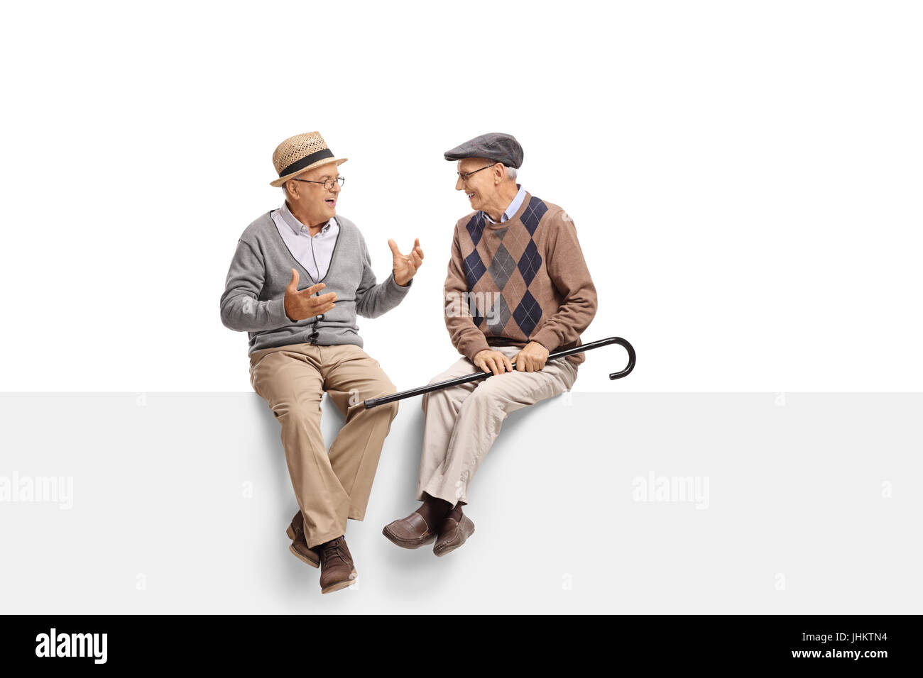 Seniors sitting on a panel and talking isolated on white background ...