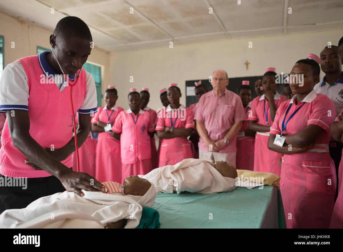 A student nurse demonstrating to the class during a training session on ...