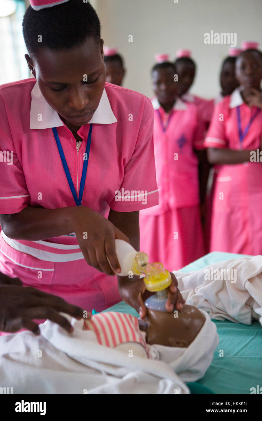 A student nurse demonstrating to the class during a training session on ...