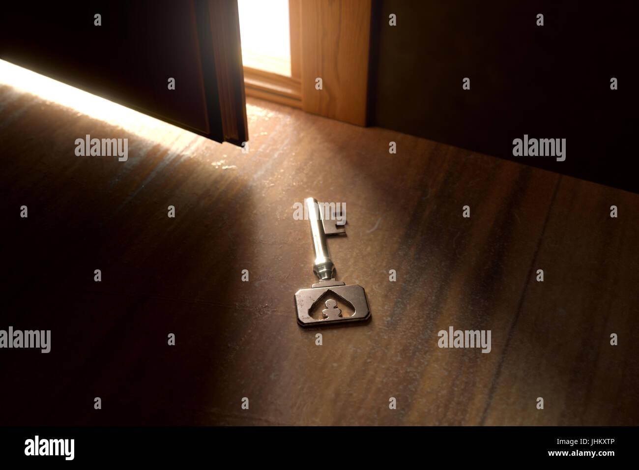 3d rendering of rusty vintage key laying on wooden floor in front of ...