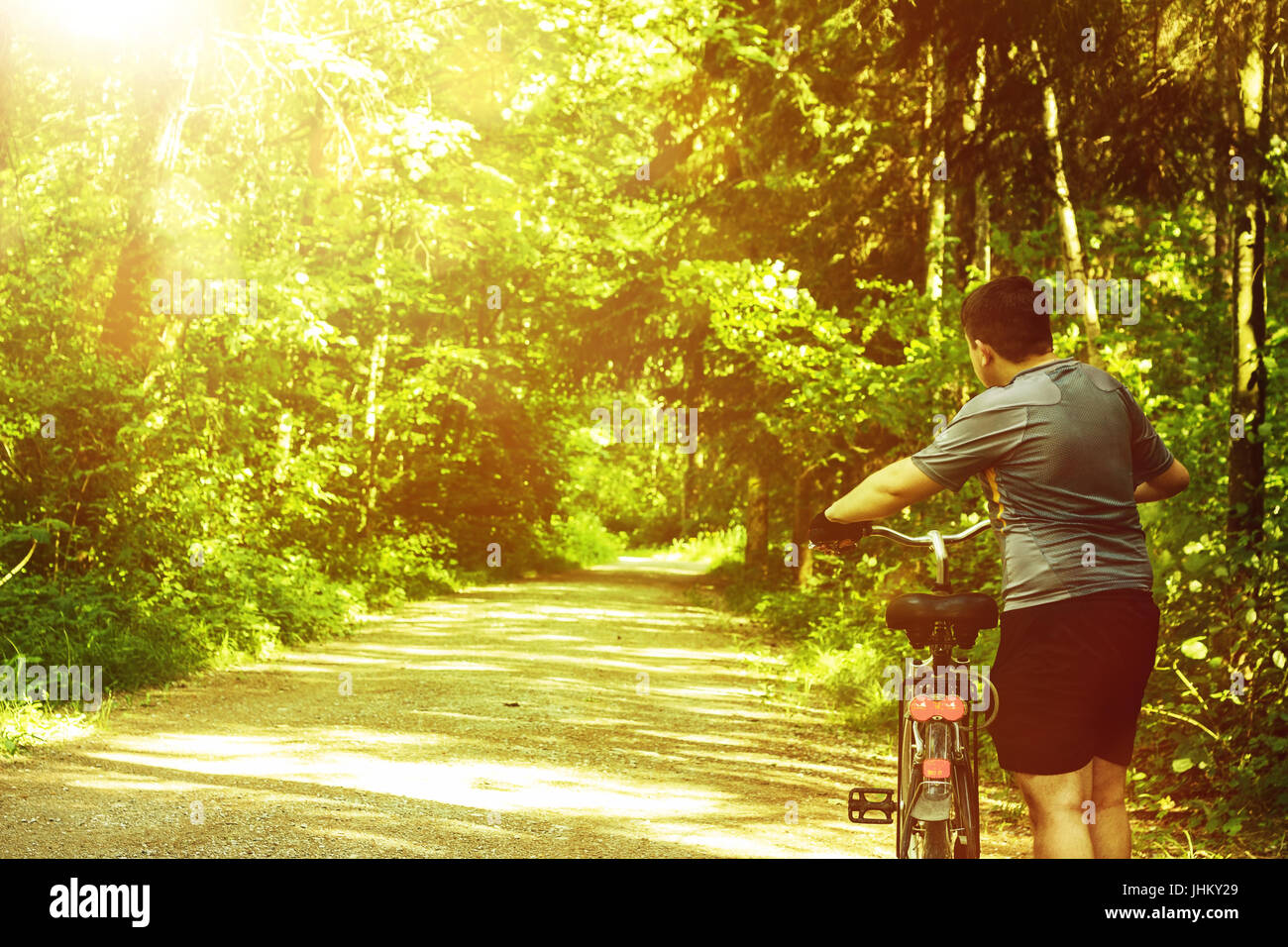 Man pushing his bicycle hi-res stock photography and images - Alamy