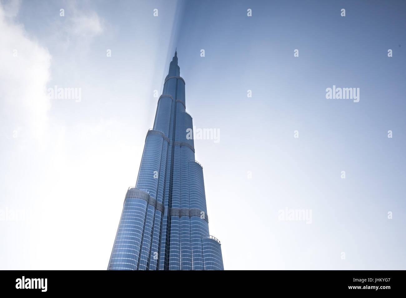 Dubai, UAE - Jun 3, 2017: Burj Khalifa casting a shadow through rare ...