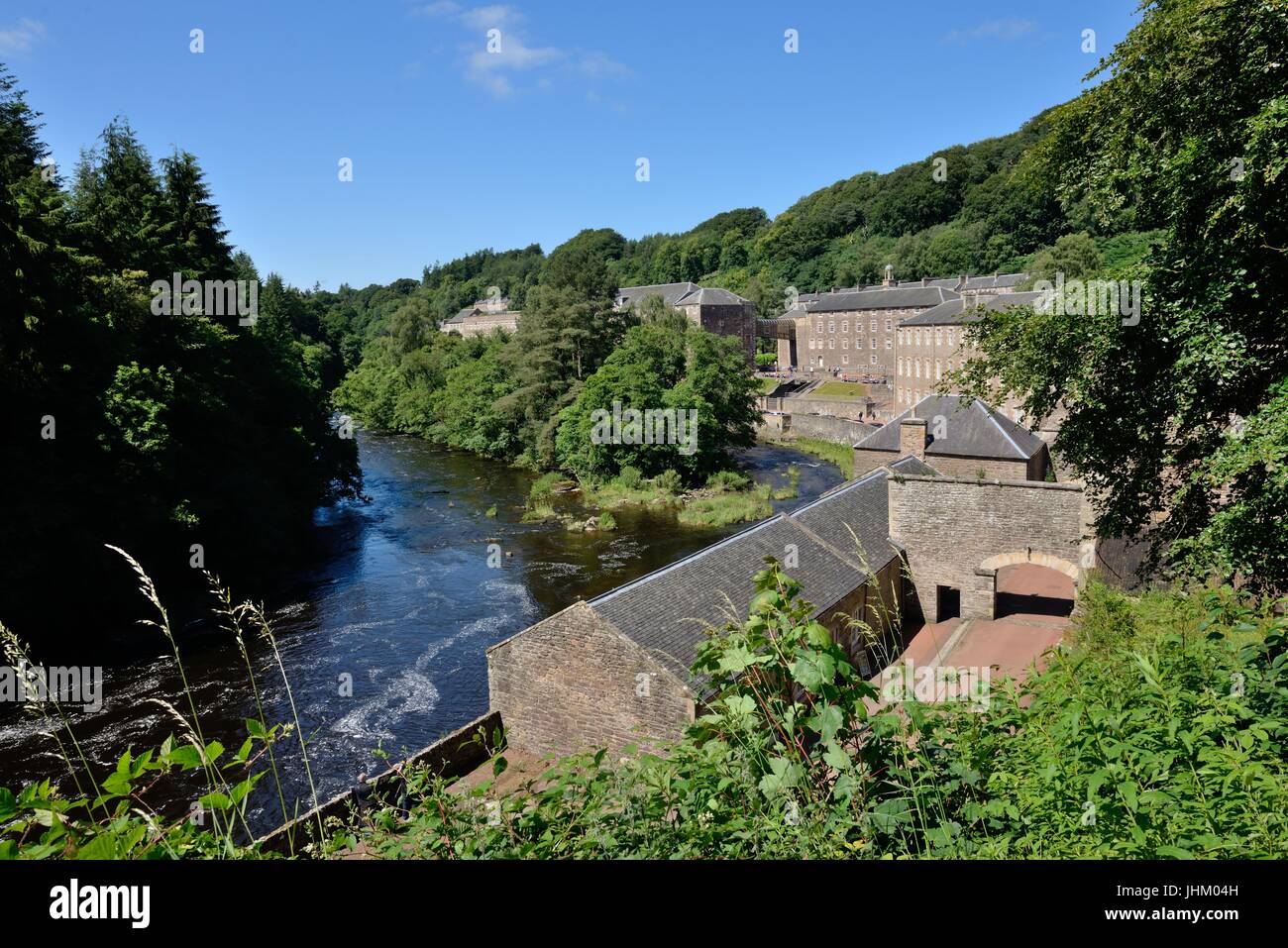 The river Clyde runs past the mill at the New Lanark World Heritage ...