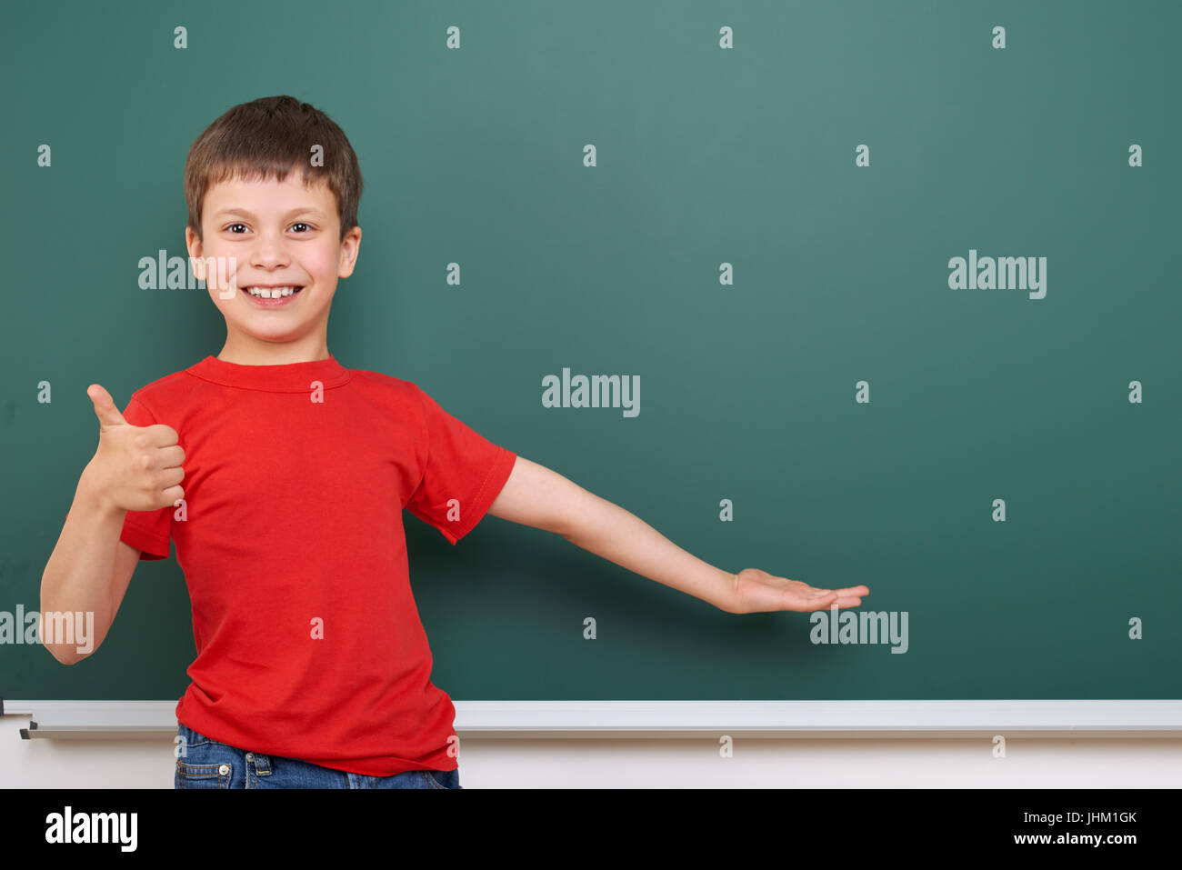 Schoolboy play near a blackboard, empty space, education concept Stock ...