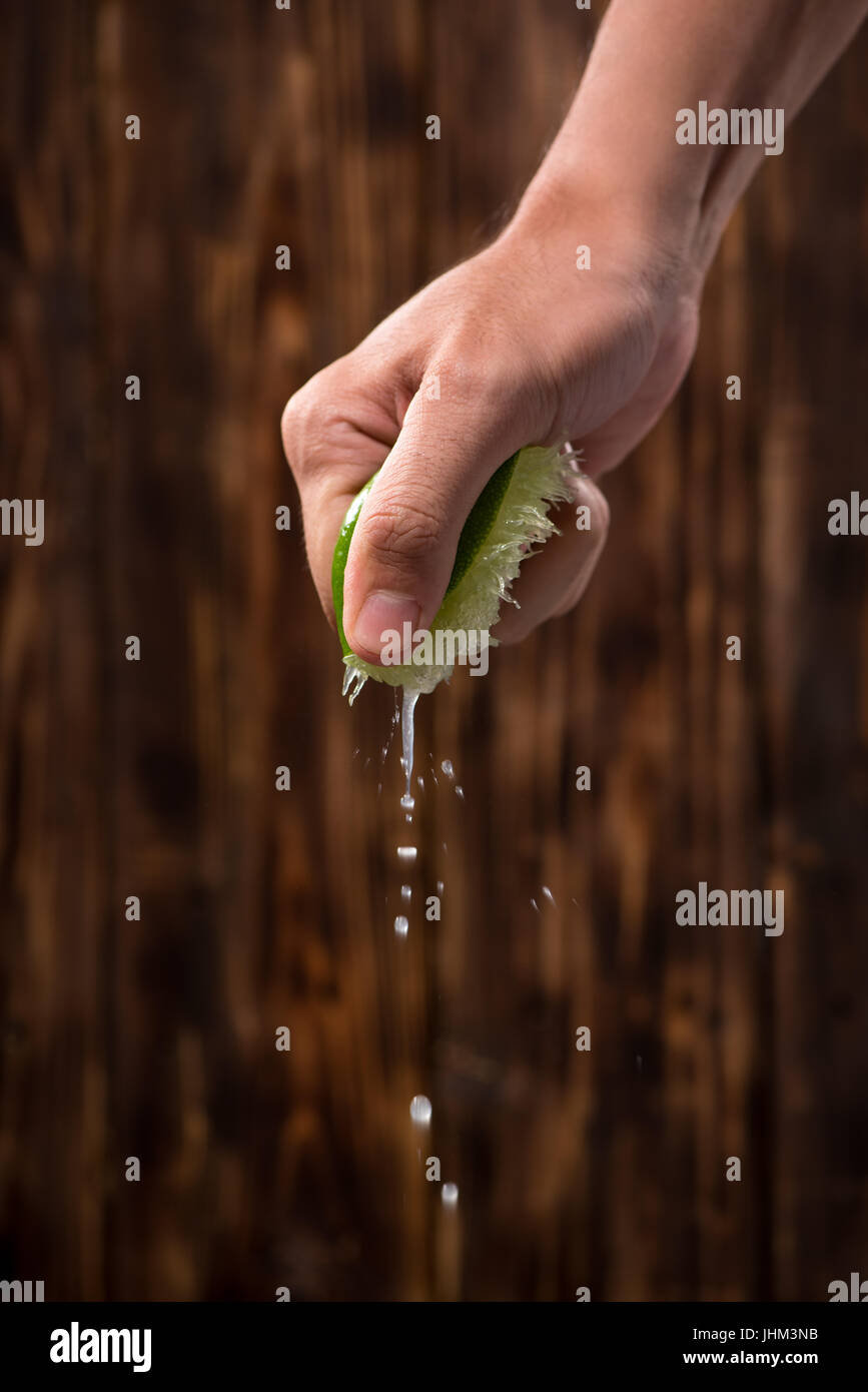 Squeezing fresh green lime hi-res stock photography and images - Alamy