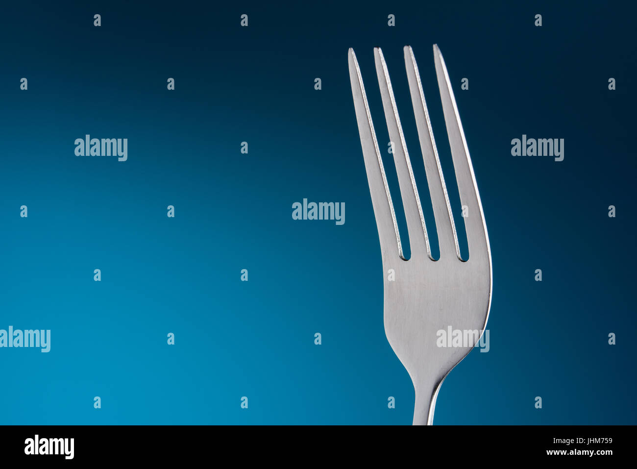 Fork in Blue Background Stock Photo - Alamy