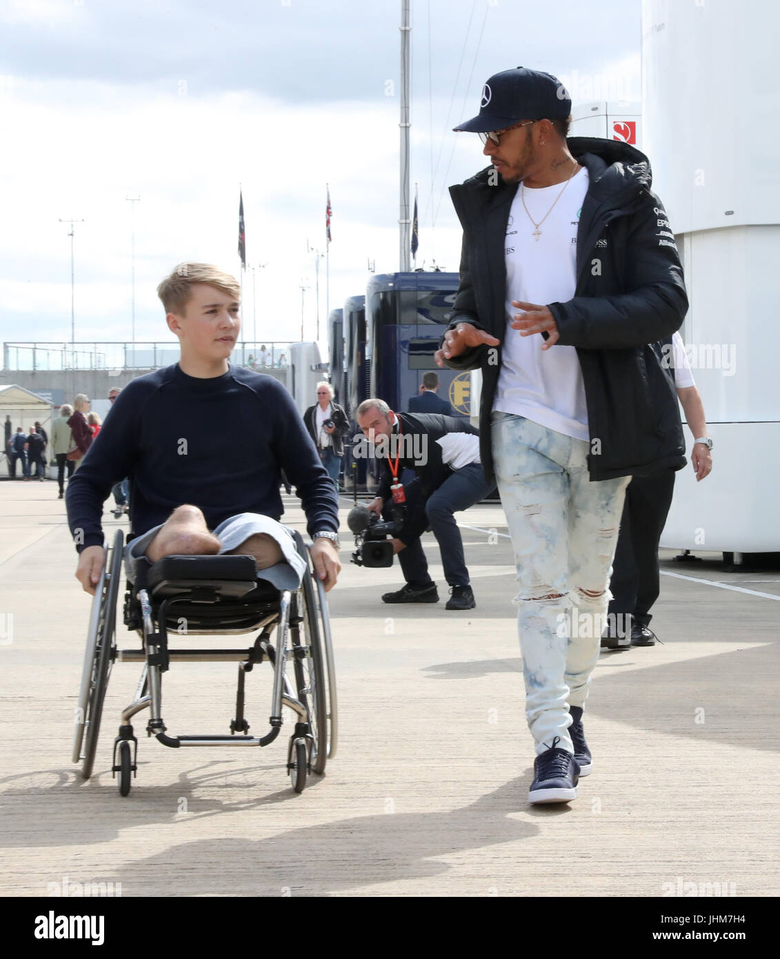 Merecedes' Lewis Hamilton (left) and amputee teenage racing driver ...