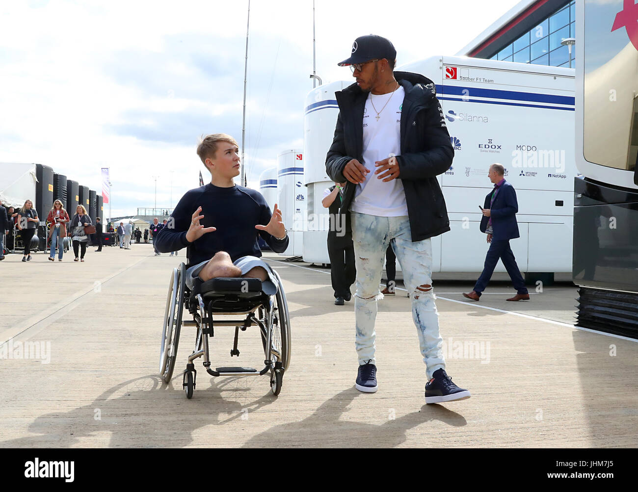 Merecedes' Lewis Hamilton (right) and amputee teenage racing driver ...