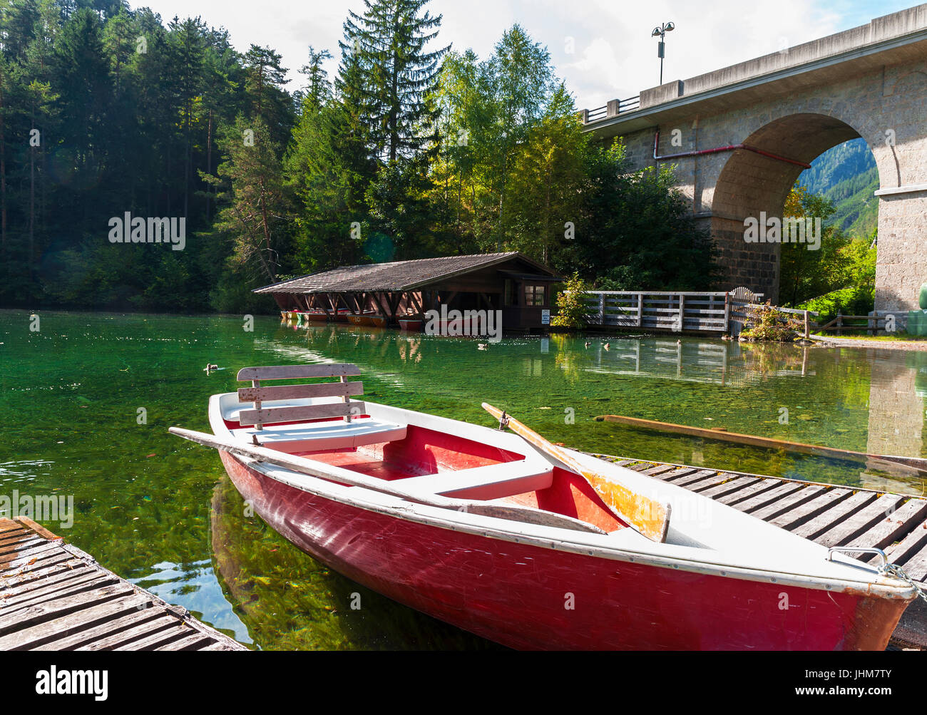 Boats on a quay at alpine lake Stock Photo - Alamy