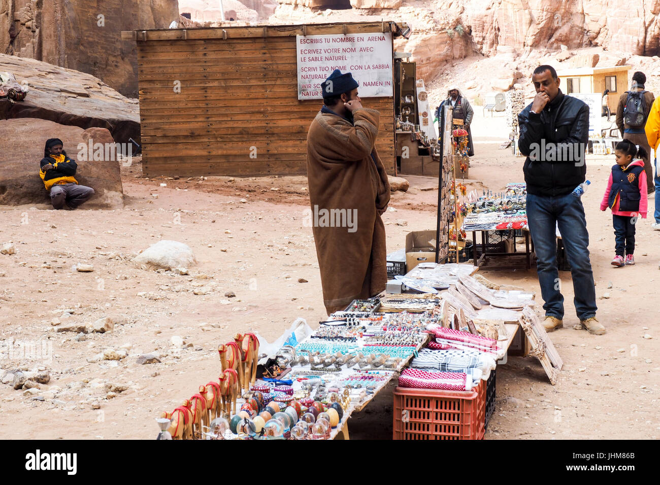 Bedouin man selling souvenirs from a makeshift stall in Petra, Jordan ...