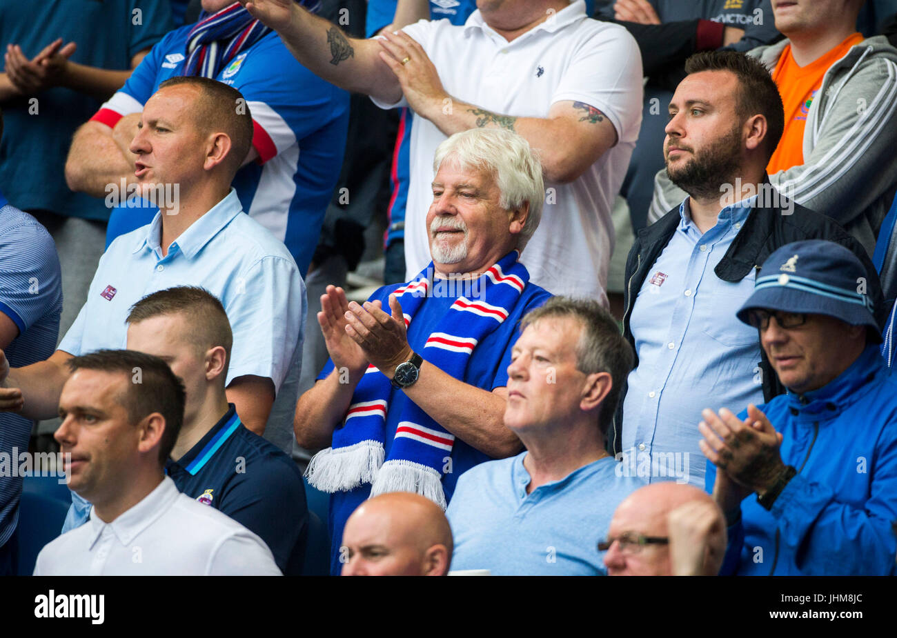 Former DUP MLA Sammy Douglas (centre) among the Linfield fans during ...