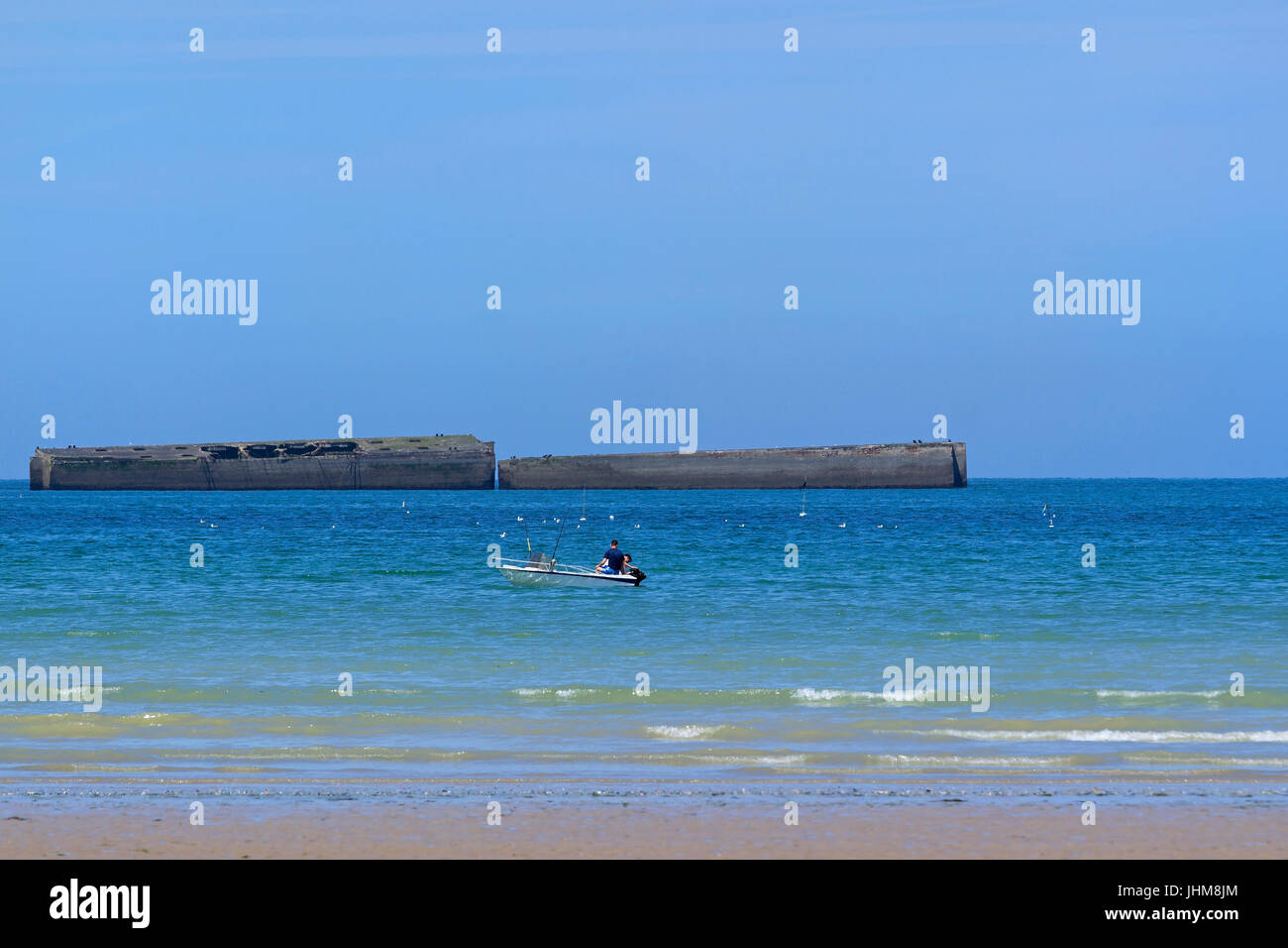 ARROMANCHES, FRANCE - JUNE 2014; Remains of the temporary harbor used ...