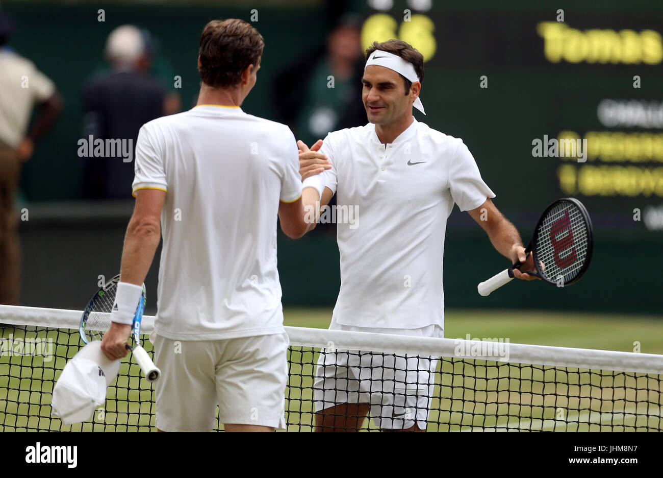 Roger Federer (right) and Tomas Berdych shake hands after their match ...