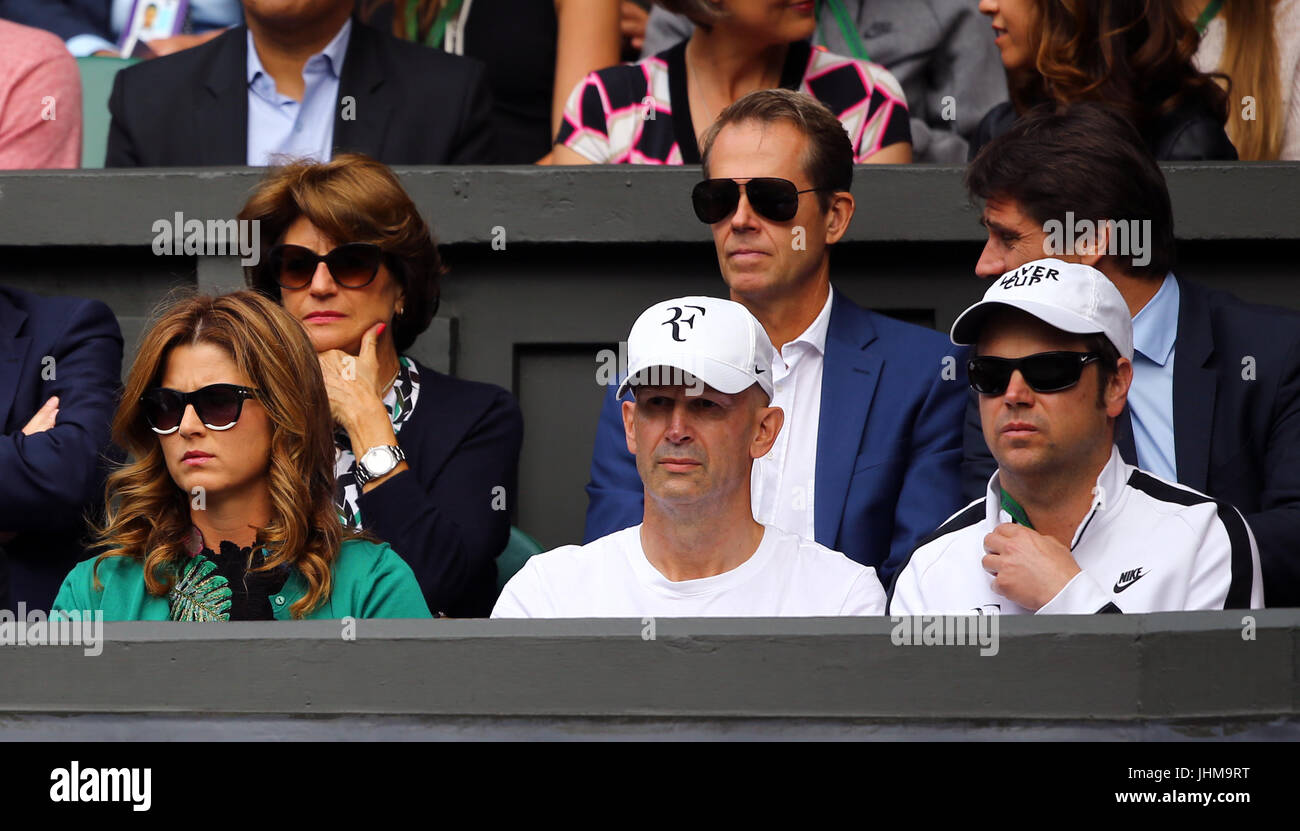 Roger Federer's wife Mirka (left) and his team look on during his ...