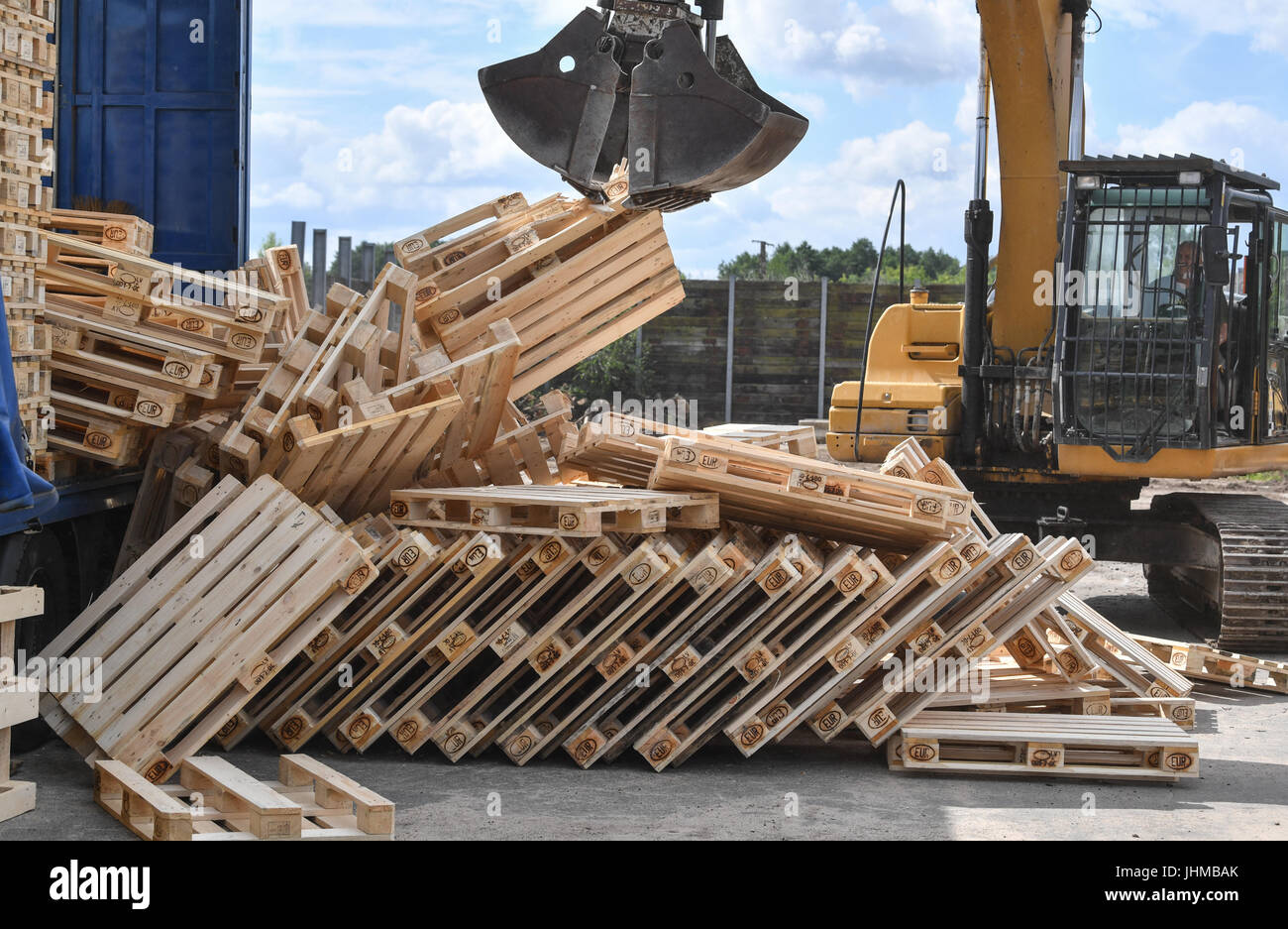 Counterfeit euro-pallets being destroyed in the yard of a recycling ...